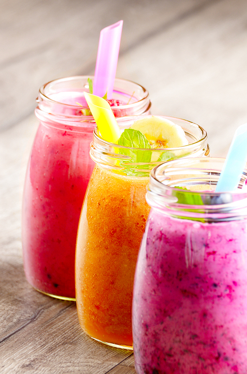 유토이미지 | Assorted fruit shakes on white table. Smoothie concept