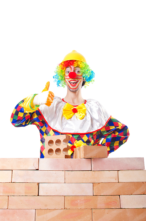 유토이미지 | Bad construction concept with clown laying bricks