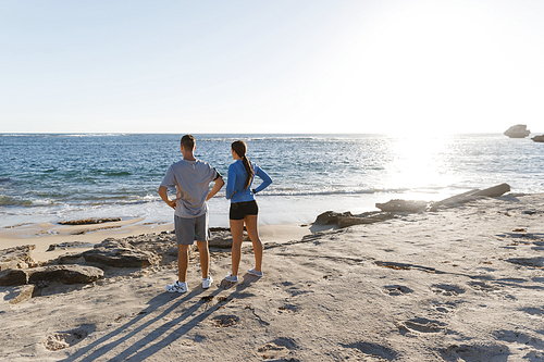 Young couple on beach training and exercising together | 유토이미지 | 상세페이지 ...