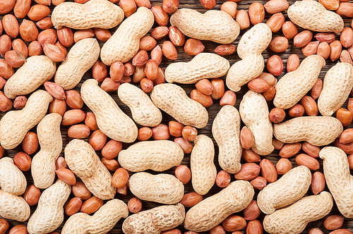 Peanuts scattered on a wooden table. Background with nuts. | 유토이미지 | 상세 ...