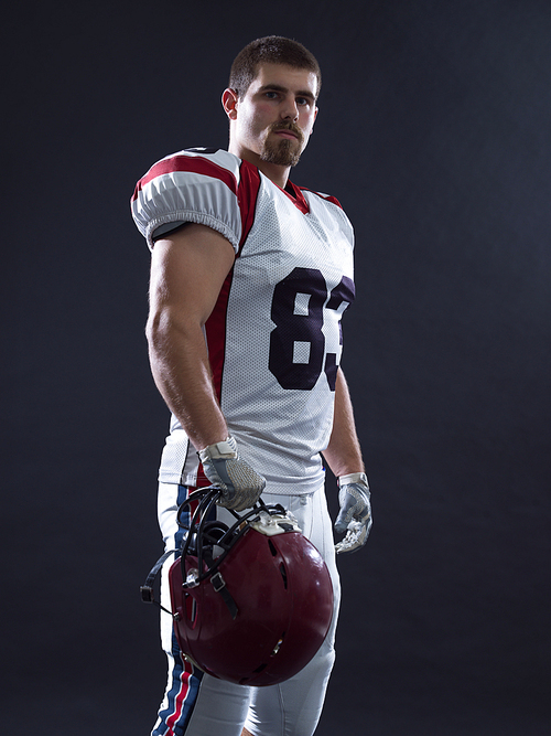 유토이미지 | Portrait of a strong muscular American Football Player isolated ...