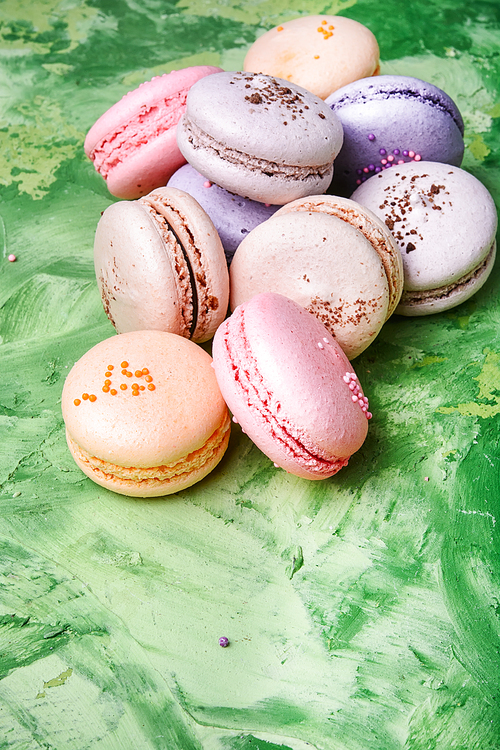 French macaroons dessert on a green background | 유토이미지 | 상세페이지 | 베이직샵 ...