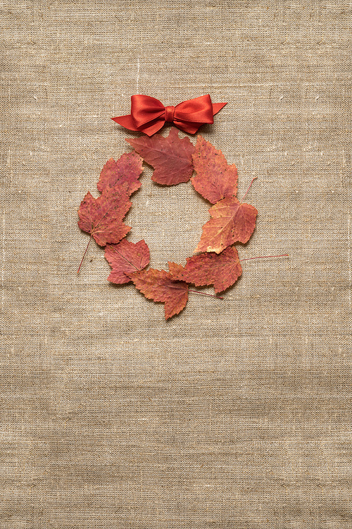 Creative thanksgiving day concept photo of leaves on brown background ...