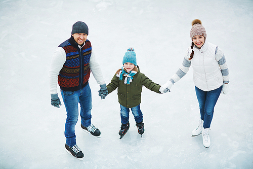 Two parents with son skate in ice skating in winter | 유토이미지 | 상세페이지 ...