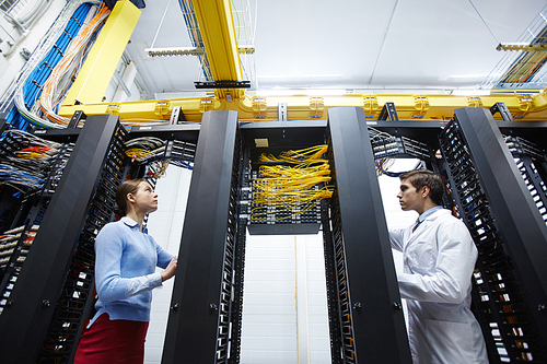 Staff of modern mining farm checking or testing new bitcoin storage ...