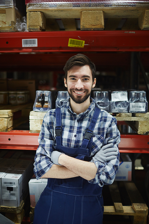 유토이미지 | Successful warehouse worker standing by shelf with packed goods