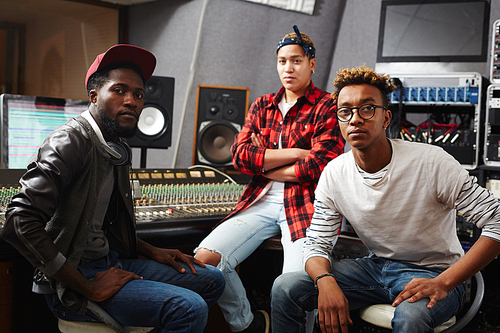 유토이미지 | Team of professional musicians or sound operators sitting in studio of music production