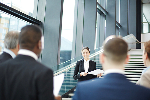 유토이미지 | Young businesswoman making report in front of audience at ...