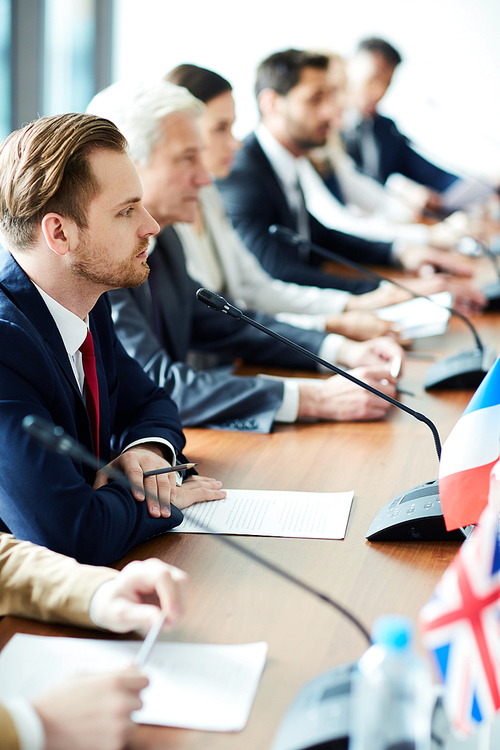 유토이미지 | Serious thoughtful official representatives in formal suits ...