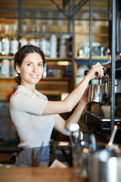 유토이미지 | Happy young female barista looking at you while standing by ...