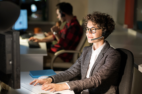Portrait of female customer service operator smiling happily while ...