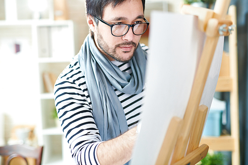 Trendy man working on illustration drawing with pencil on paper ...