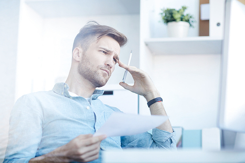 유토이미지 | Side view portrait of handsome young man frowning in thought ...