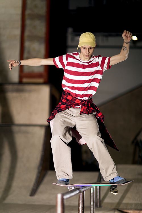유토이미지 | Full length action shot of contemporary young man sliding on ...