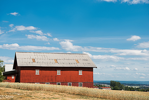 red farm building under blue cloudy sky, Hamar, Hedmark, Norway | 유토이미지 ...