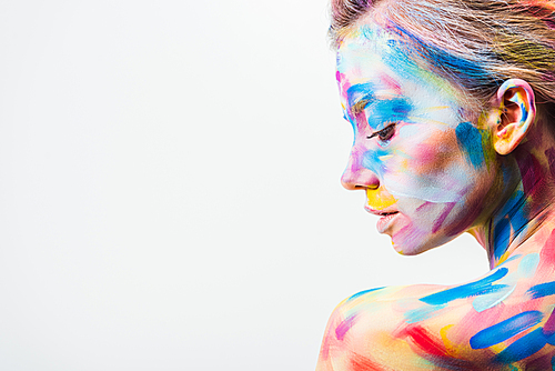 side view of attractive girl with colorful bright body art isolated on ...