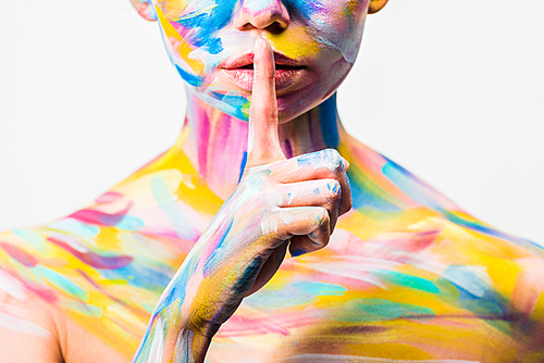 cropped image of girl with colorful bright body art showing silence ...