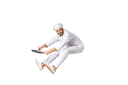 유토이미지 | happy young chef with frying pan jumping and isolated on white
