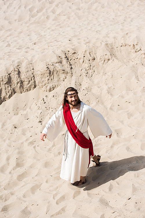유토이미지 | high angle view of Jesus in robe, red sash and crown of thorns ...