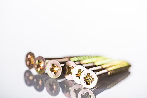 close up view of shiny heads of metal studs isolated on white | 유토이미지 ...