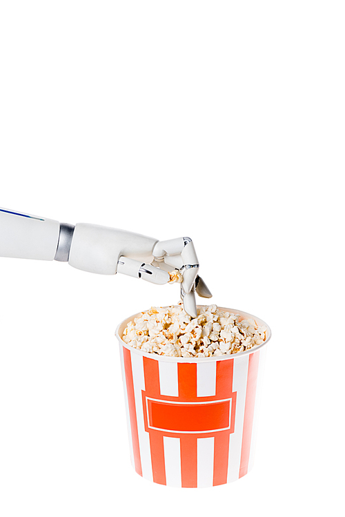 cropped shot of robot taking tasty popcorn out of bucket isolated on ...