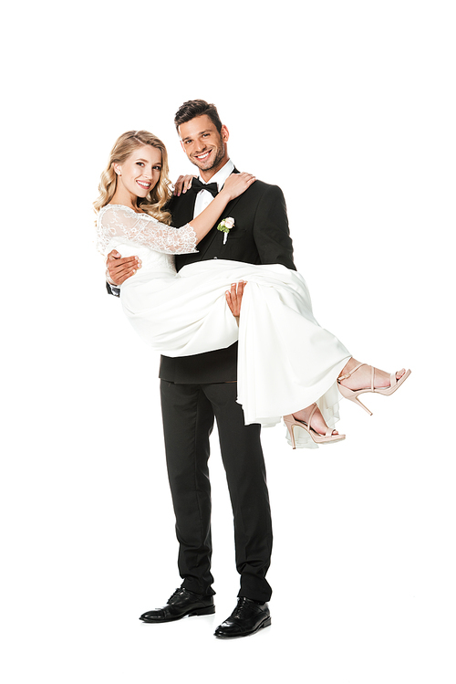 유토이미지 | handsome young groom carrying his bride isolated on white