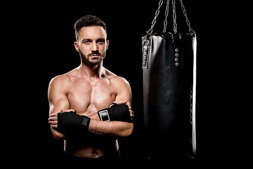 유토이미지 | muscular boxer standing with crossed arms near punching bag ...