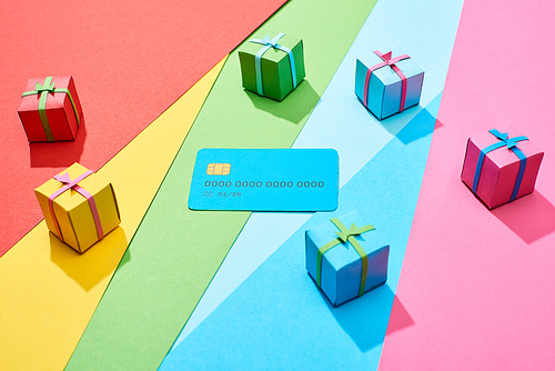 유토이미지 | empty credit card and multicolored gift boxes on rainbow background