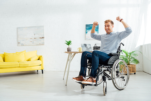 Cheerful man in wheelchair in living room | 유토이미지 | 상세페이지 | 베이직샵 | 사진 ...
