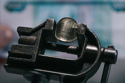 유토이미지 | close-up view of iron vise tool with one ruble coin, selective ...