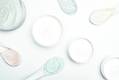 유토이미지 | flat lay with various clay masks in containers and spoons ...