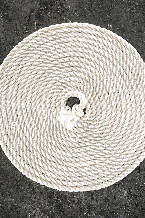 유토이미지 | top view of white nautical rope arranged in circle on dark ...