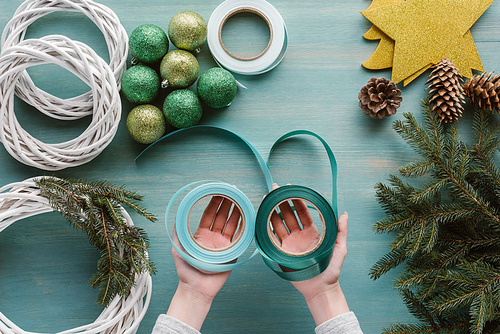 유토이미지 | partial view of woman holding ribbons for handmade christmas ...