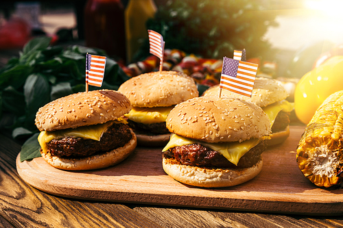 유토이미지 | Burgers with us flags grilled for outdoors barbecue