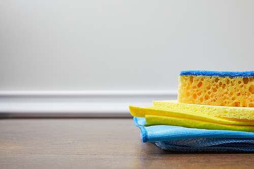 blue and yellow sponge and rags on floor for spring cleaning | 유토이미지 ...