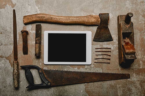 Flat lay with different carpentry tools and digital tablet on old ...