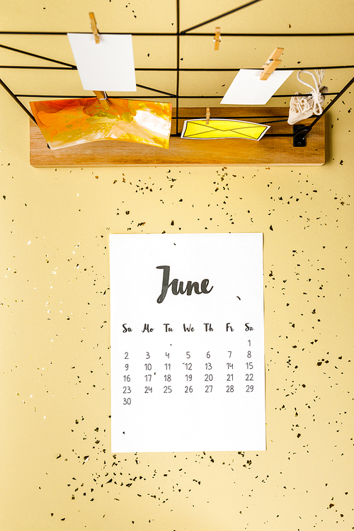 유토이미지 | top view of june calendar with golden confetti and cards with ...