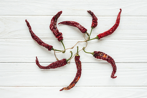 bundle of red chilli peppers on white wooden background | 유토이미지 | 상세페이지 ...