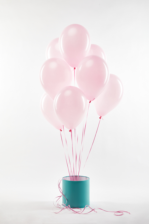 유토이미지 | bundle of pink balloons with turquoise gift box on white