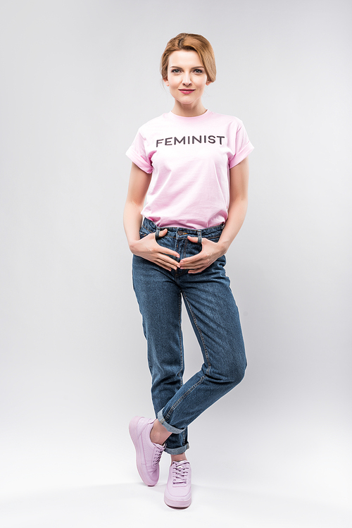 attractive woman posing in pink feminist t-shirt, isolated on grey | 유토 ...