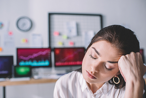 Exhausted information security analyst with hand near head in office ...