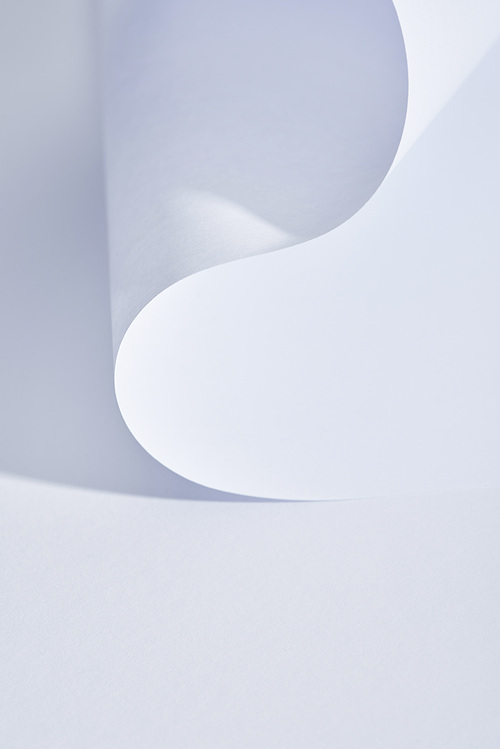 close up view of curved paper sheet on white background | 유토이미지 | 상세페이지 ...