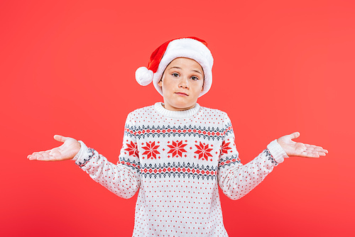 유토이미지 | front view of child in sweater and santa hat showing shrug ...