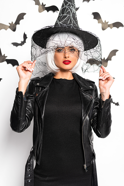 attractive woman in witch hat and wig in Halloween | 유토이미지 | 상세페이지 ...