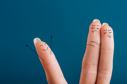 cropped view of fingers in bad mood looking at one happy finger ...