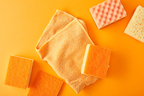 top view of rag and sponges for house cleaning on orange | 유토이미지 | 상세 ...