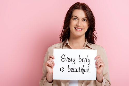 유토이미지 | Beautiful smiling woman holding card with every body is ...