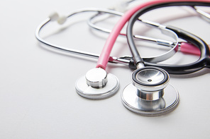 Close up view of pink ribbon near stethoscope isolated on white | 유토이미지 ...