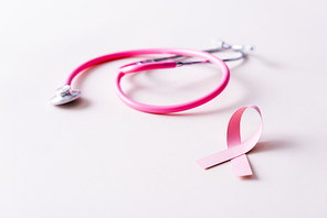 Close up view of pink ribbon near stethoscope isolated on white | 유토이미지 ...