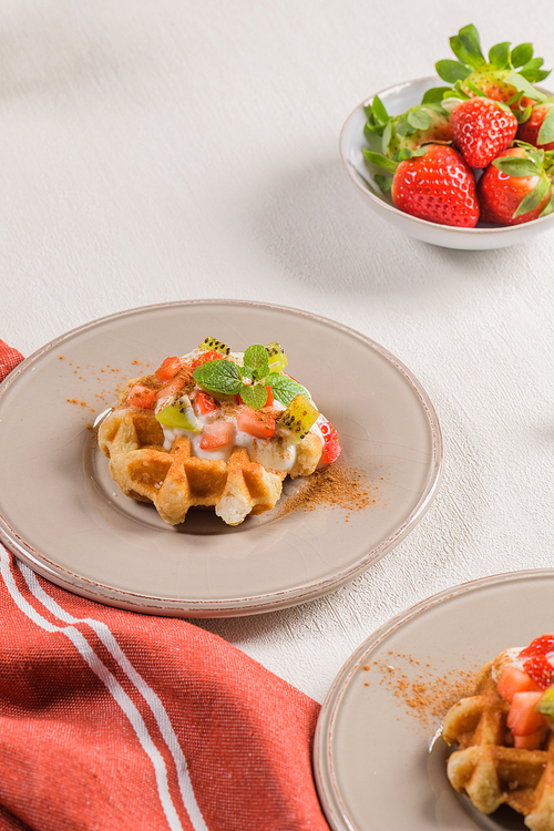 Fresh egg waffles dessert for breakfast with yogurt, strawberries and ...